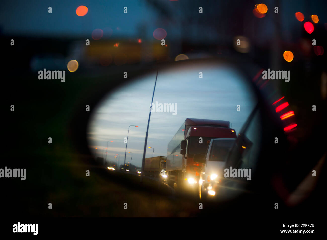 the mirror of a car with traffic visible Stock Photo - Alamy