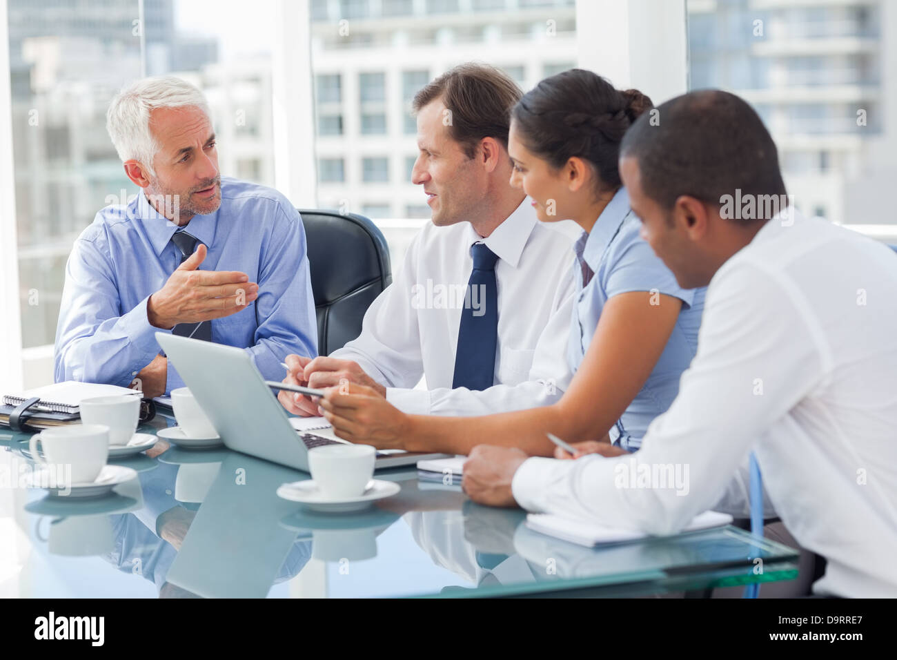 Group of business people brainstorming together Stock Photo - Alamy