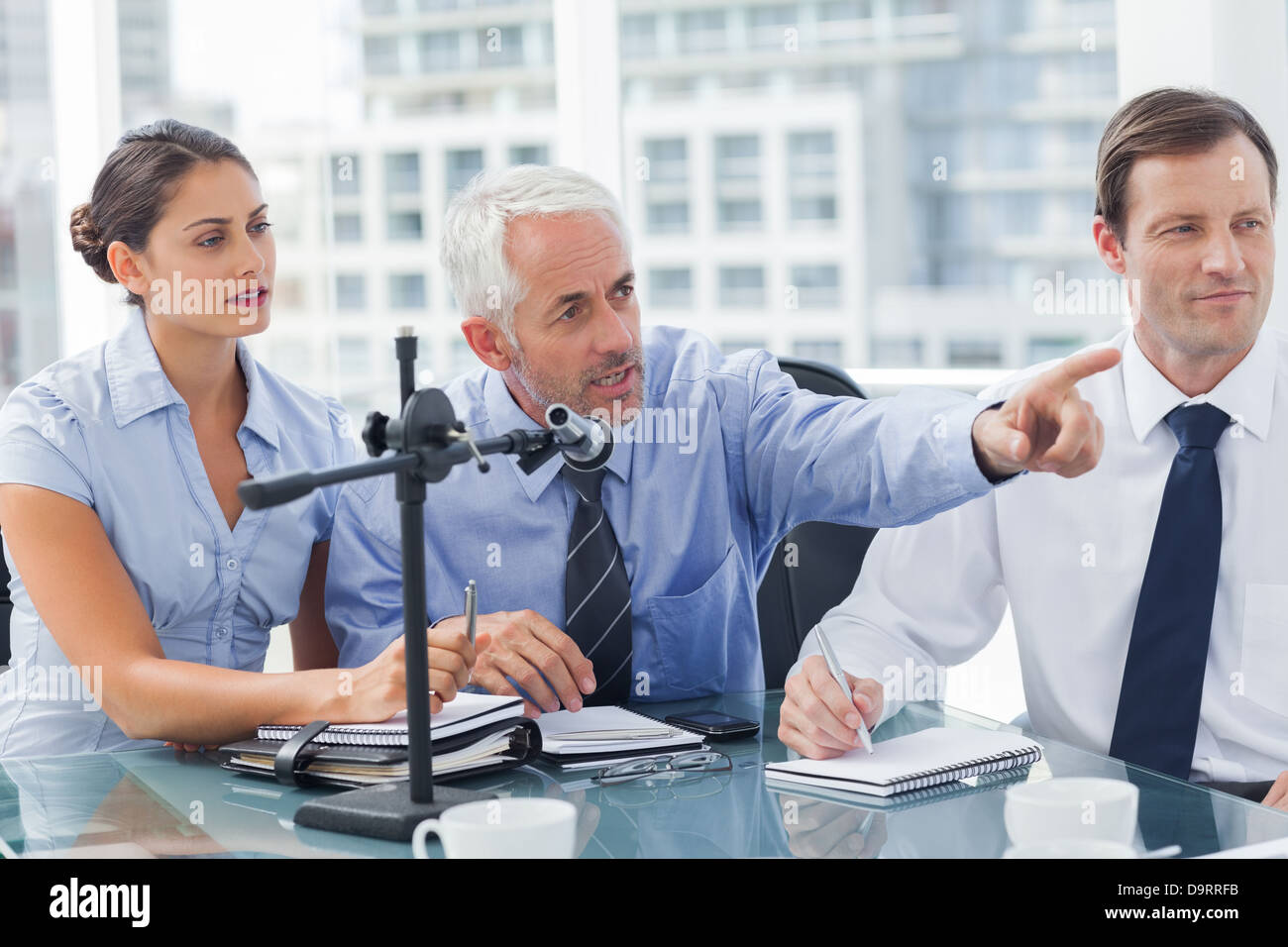 Man explaining something to a woman hi-res stock photography and images ...