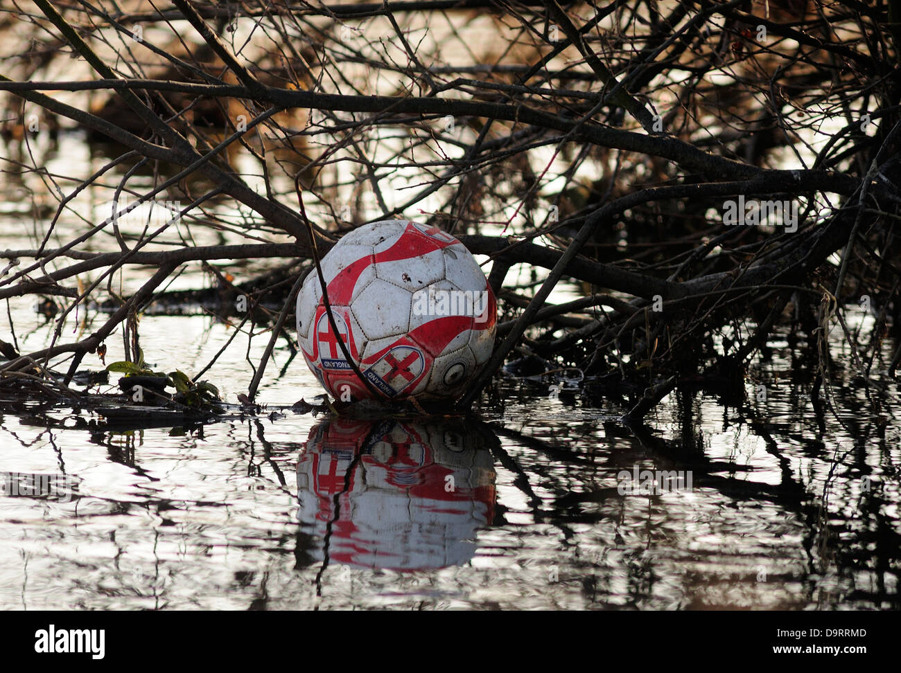 An England football in a river Stock Photo - Alamy