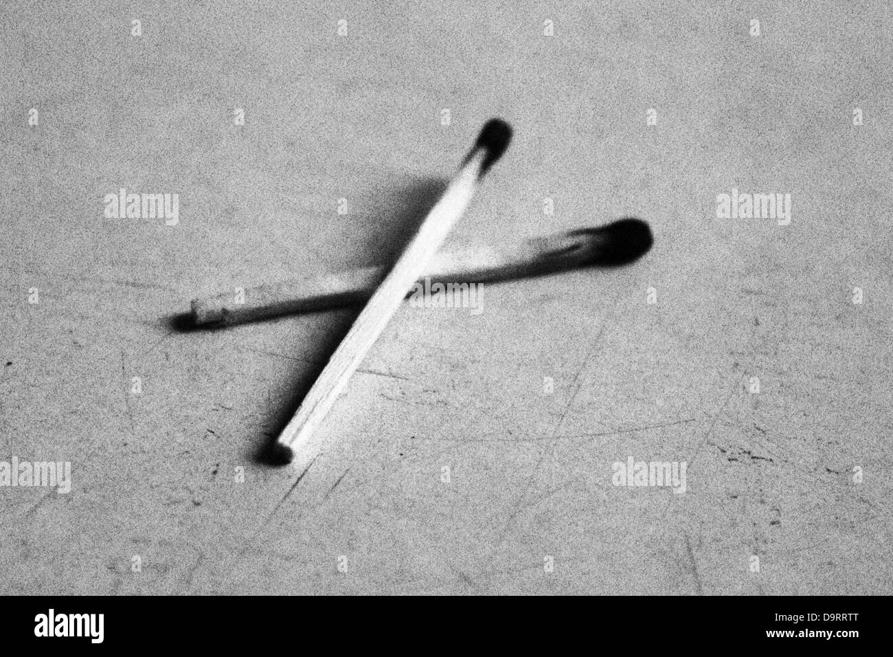 the black and white image of two burnt matches Stock Photo - Alamy