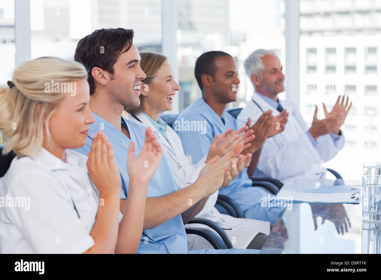 Doctors clapping their hands Stock Photo - Alamy