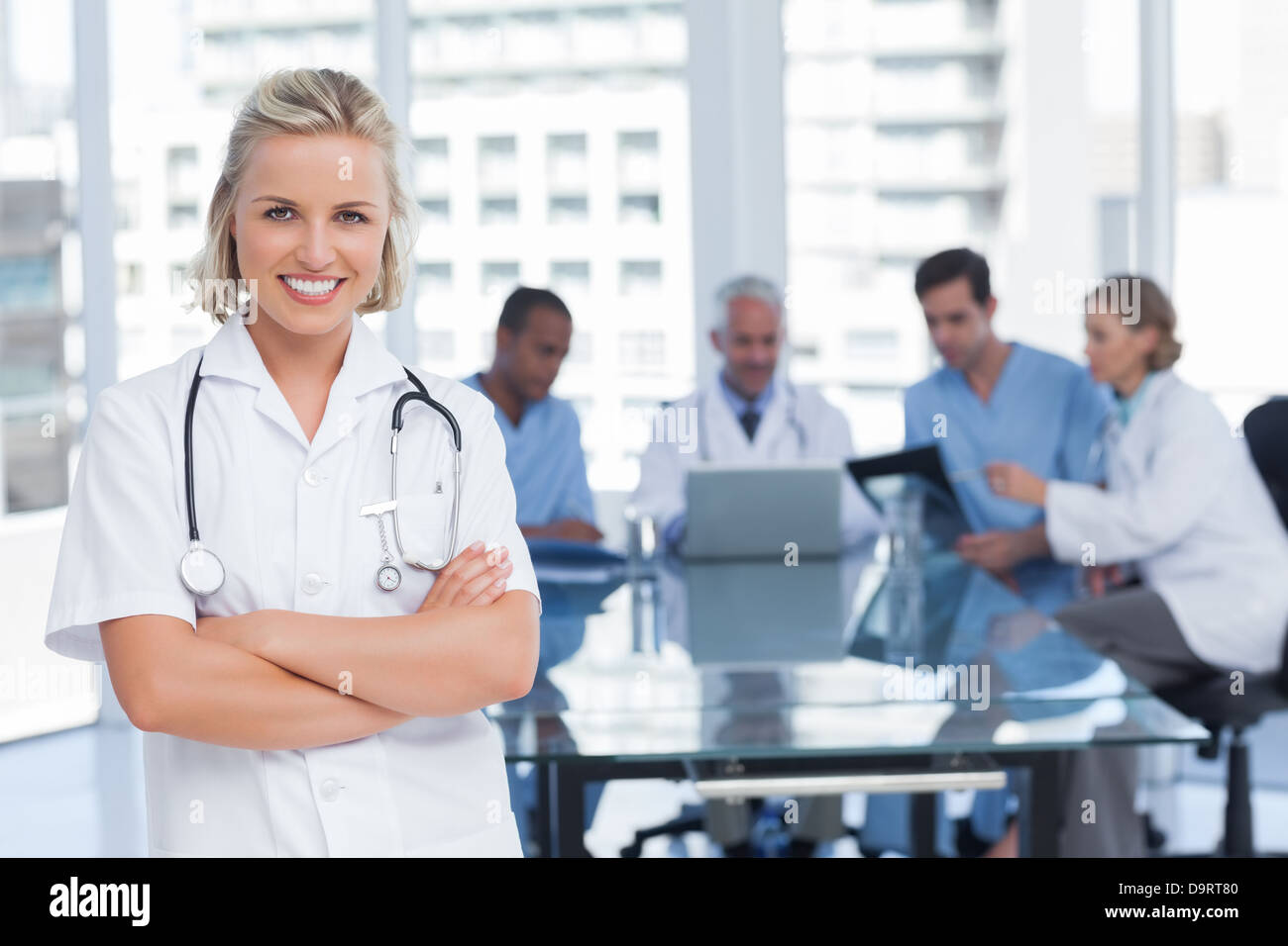 Nurse with arms crossed Stock Photo - Alamy