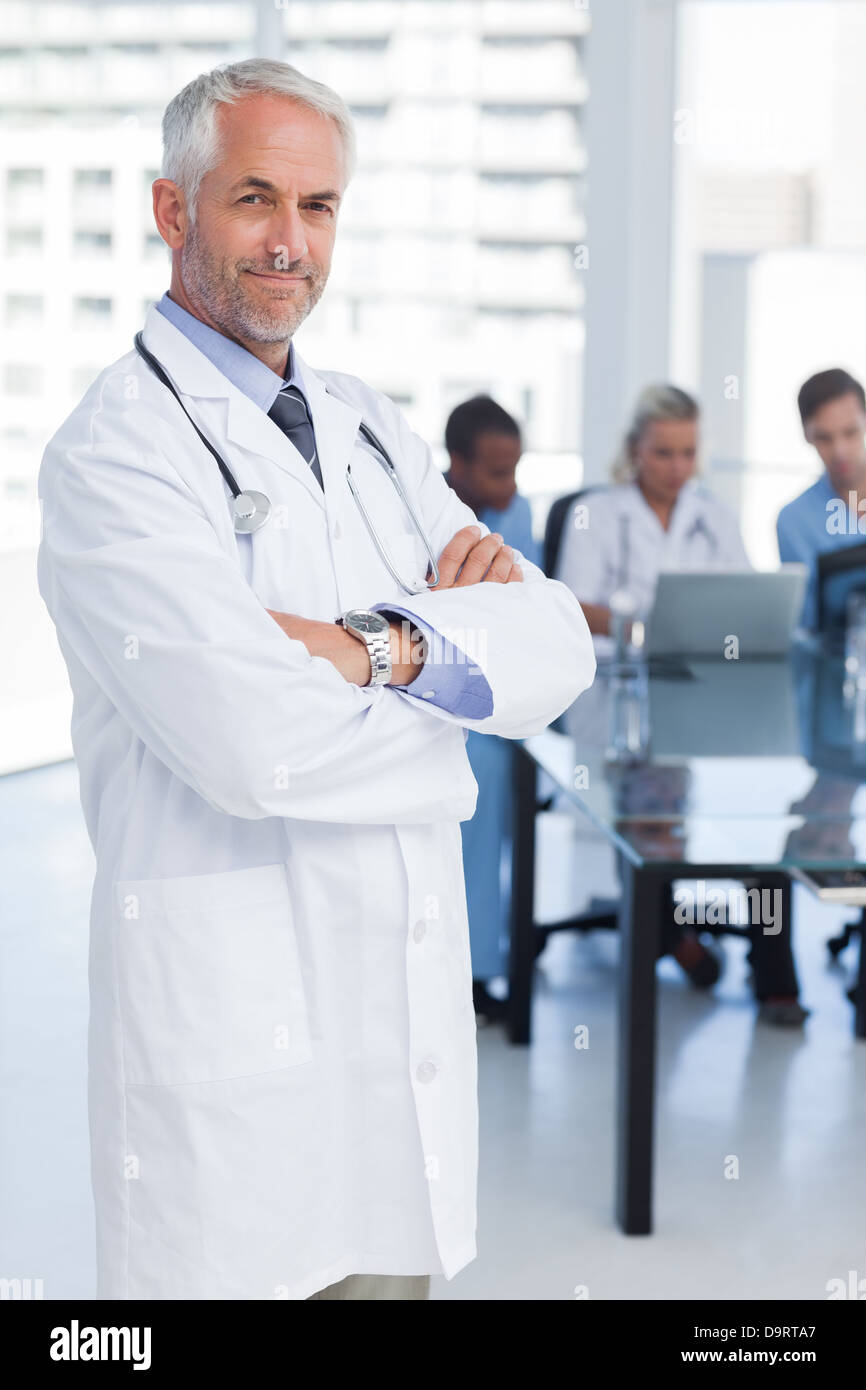 Doctor with arms crossed Stock Photo - Alamy