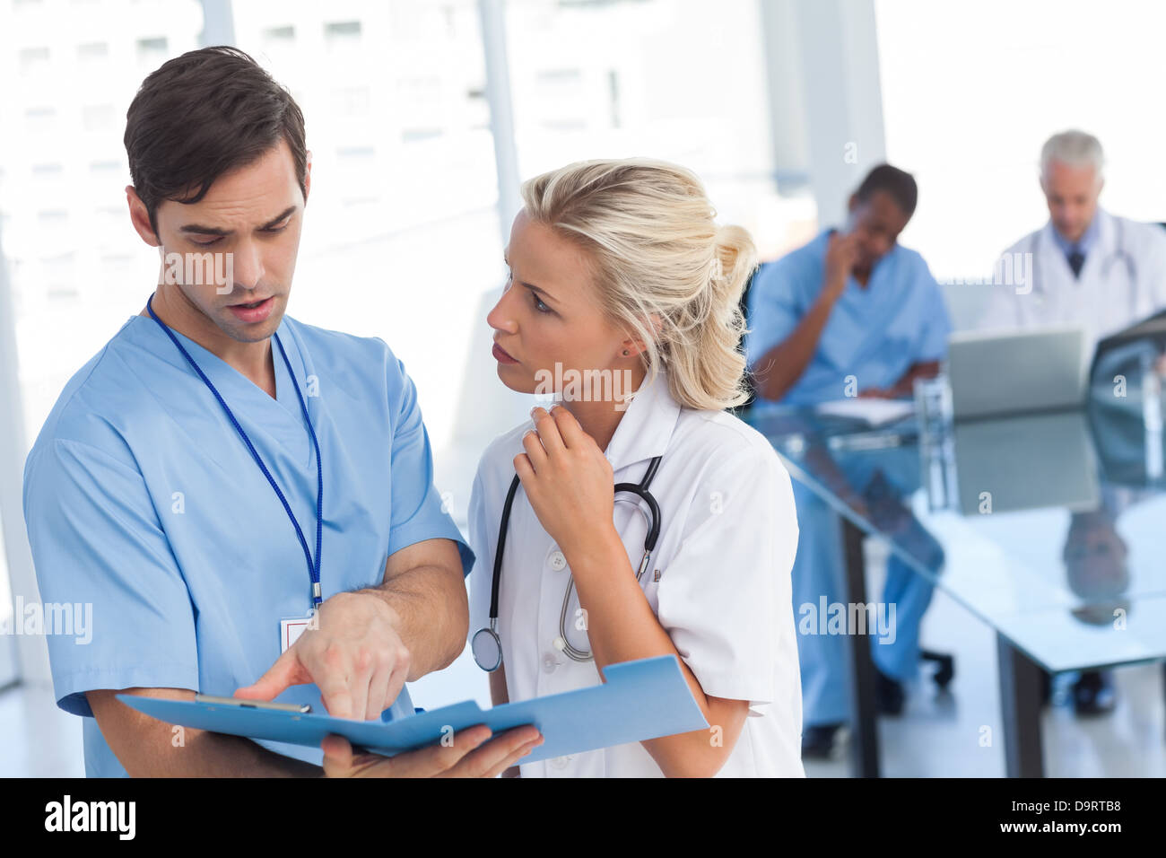 Man at doctors office talking hi-res stock photography and images - Alamy