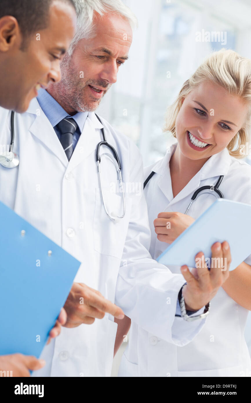 Doctor showing his tablet Stock Photo - Alamy