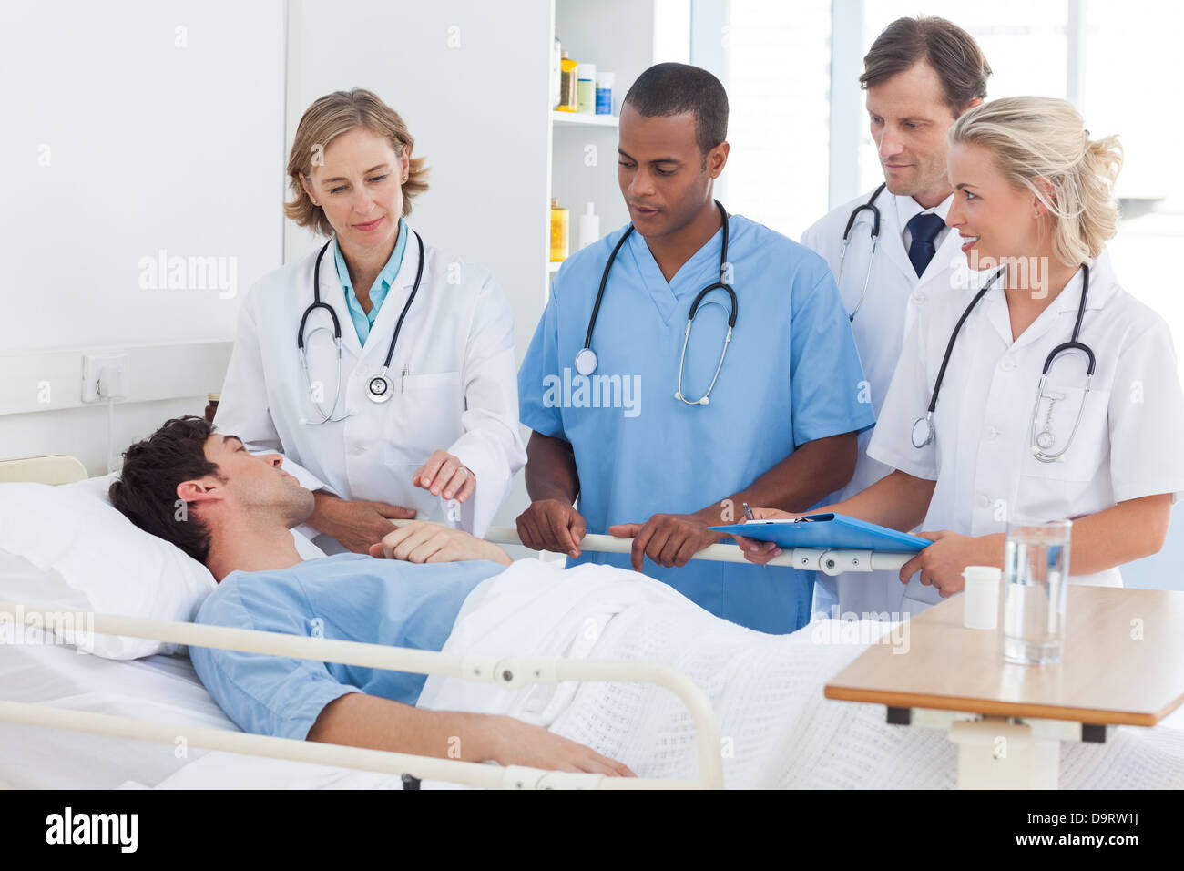 Happy patient with team hi-res stock photography and images - Alamy
