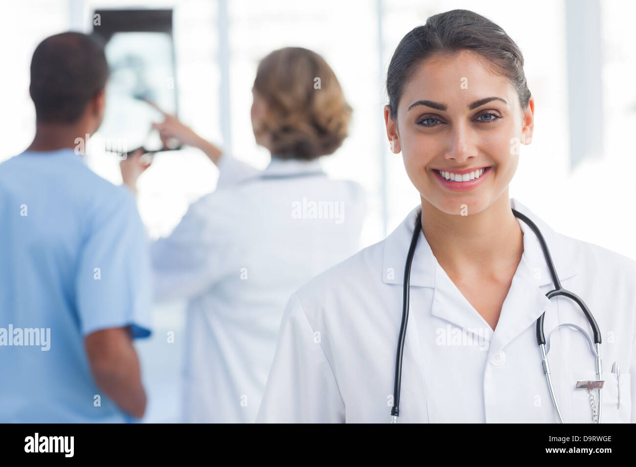 Young female doctor talking camera hi-res stock photography and images ...