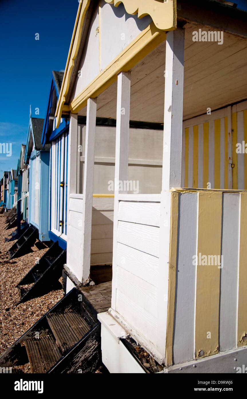 Seafront views showing beach huts , sand, sea and blue sky Stock Photo ...