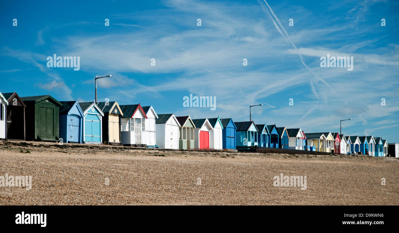 Seafront views showing beach huts , sand, sea and blue sky Stock Photo ...