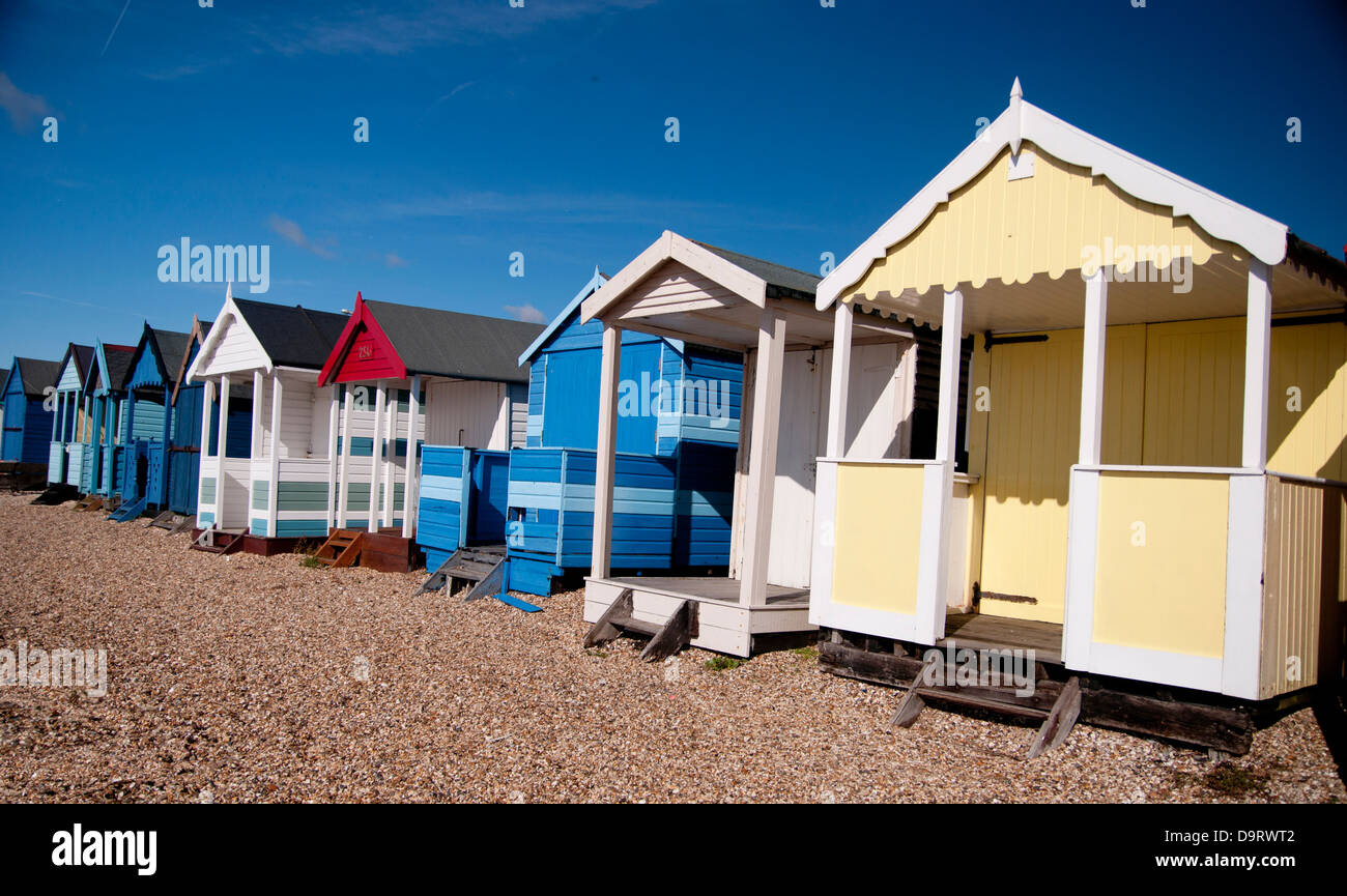 Seafront views showing beach huts , sand, sea and blue sky Stock Photo ...
