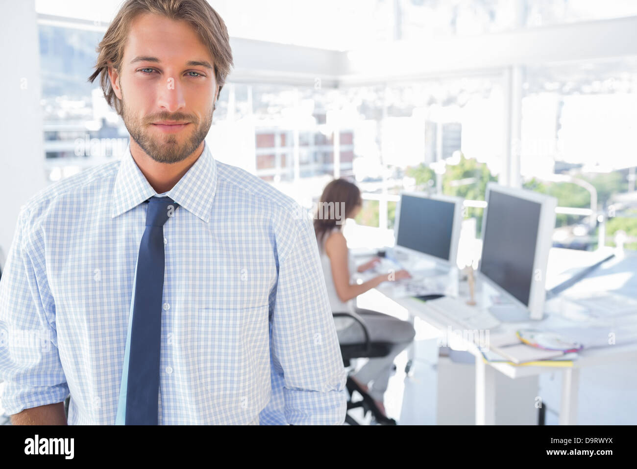 Smiling creative man in office hi-res stock photography and images - Alamy