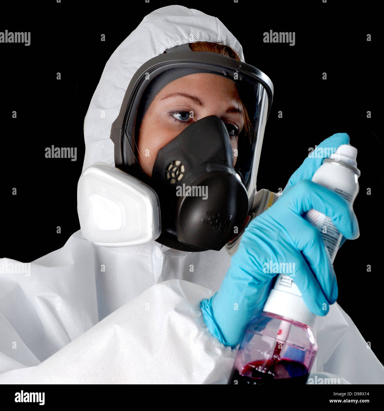 Scientist spraying chemical Stock Photo - Alamy