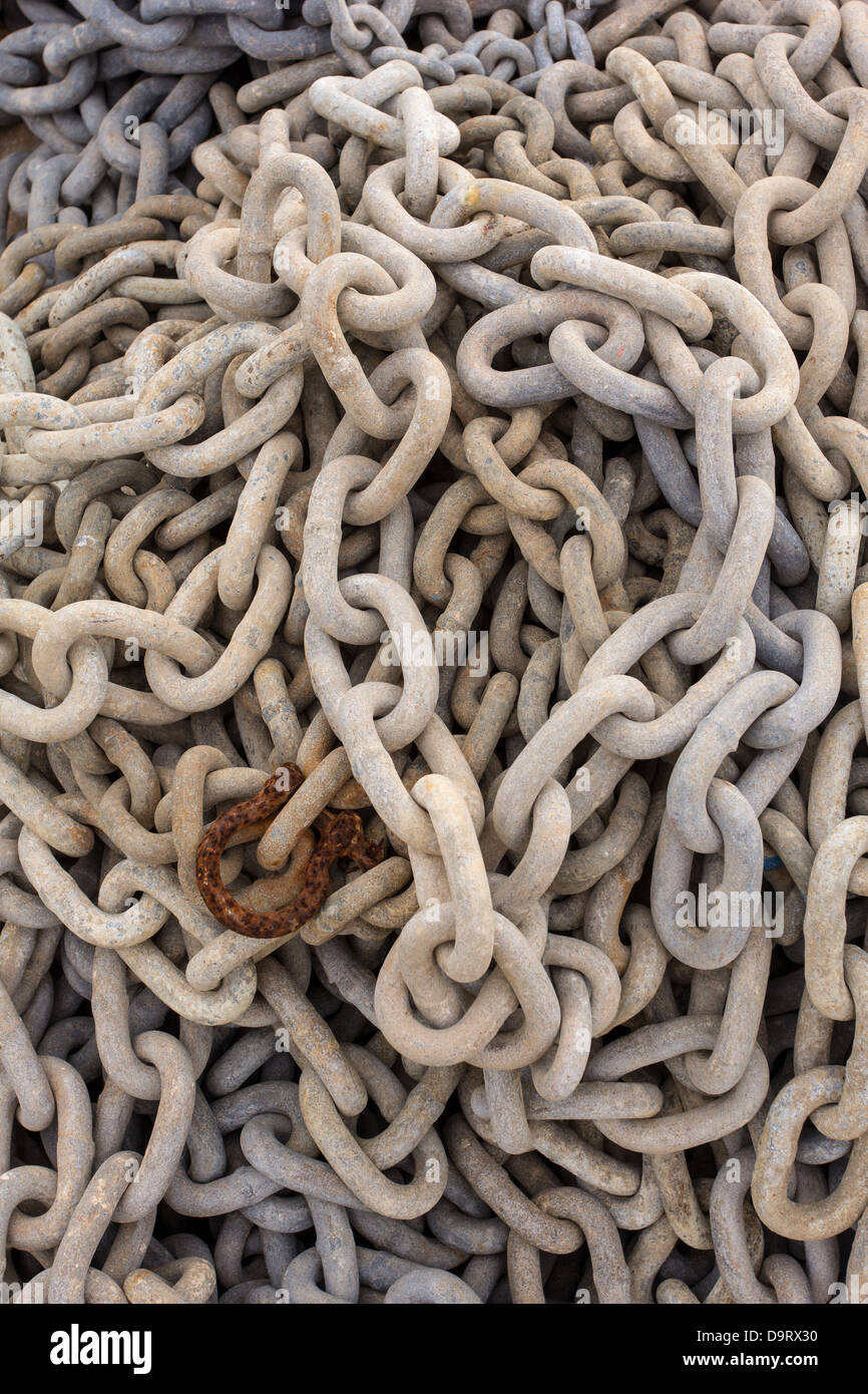 IRON CHAINS COILED IN A HEAP Stock Photo - Alamy