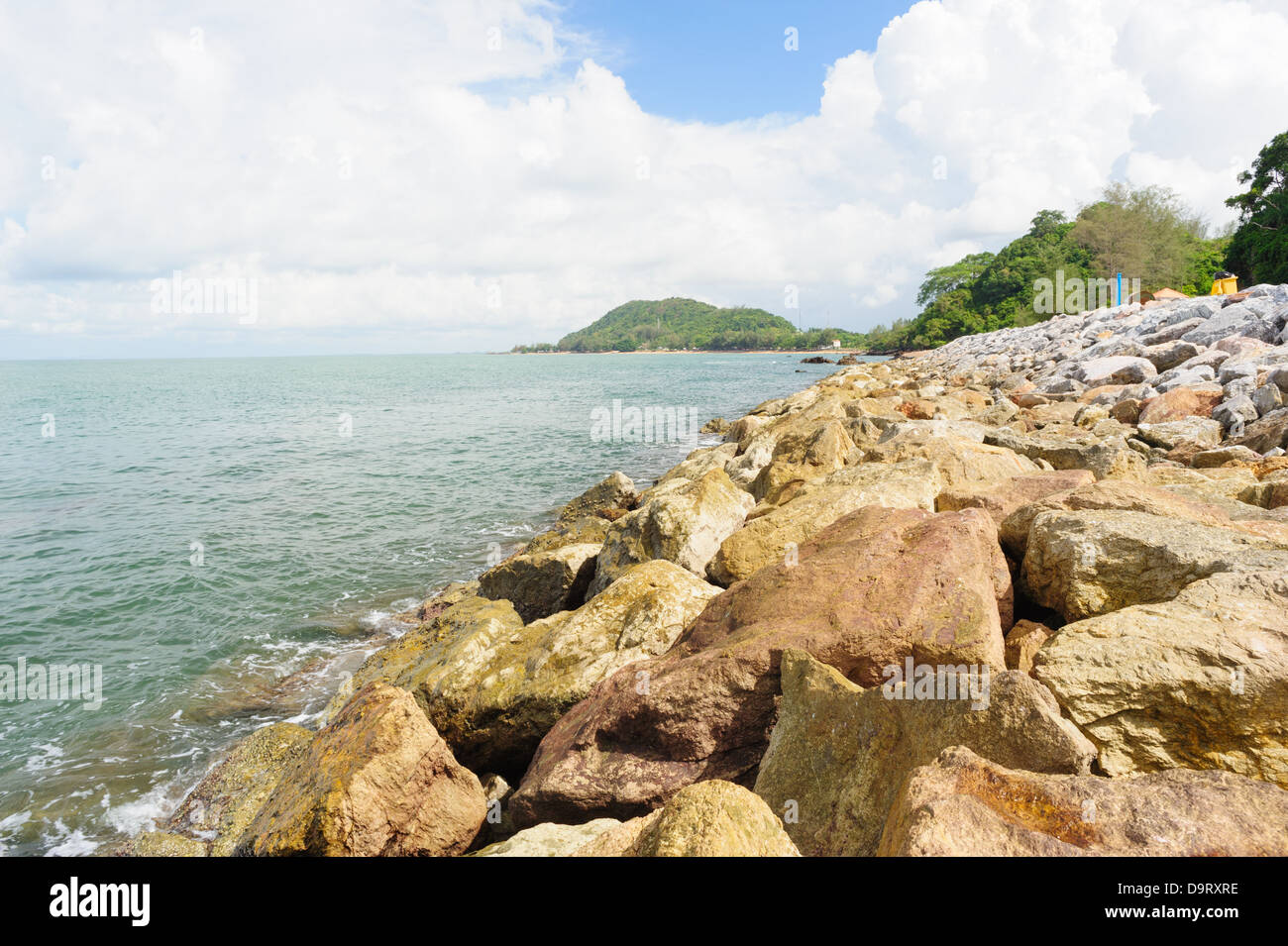 Stone wave barrier near beach in Chanthaburi, Thailand Stock Photo - Alamy