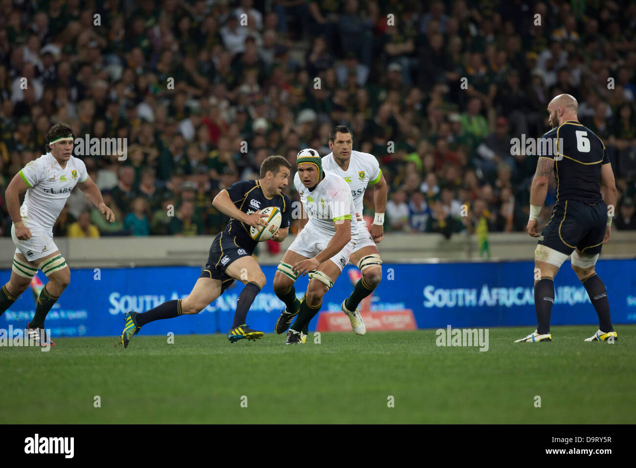 Greg Laidlaw of Scotland with the ball and Juandre Kruger in pursuit ...