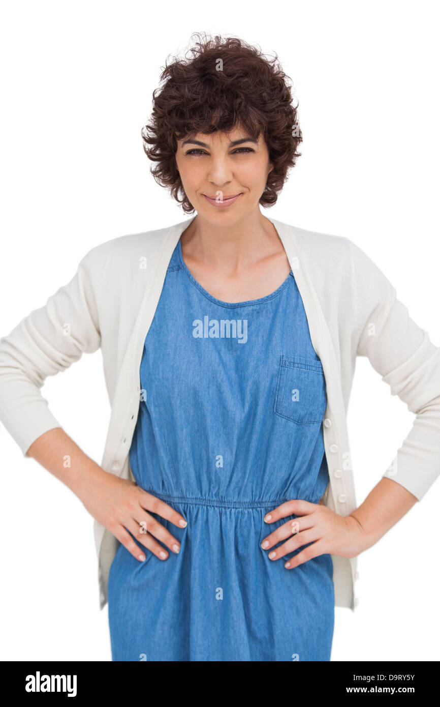 Standing woman placing hands on hips Stock Photo - Alamy