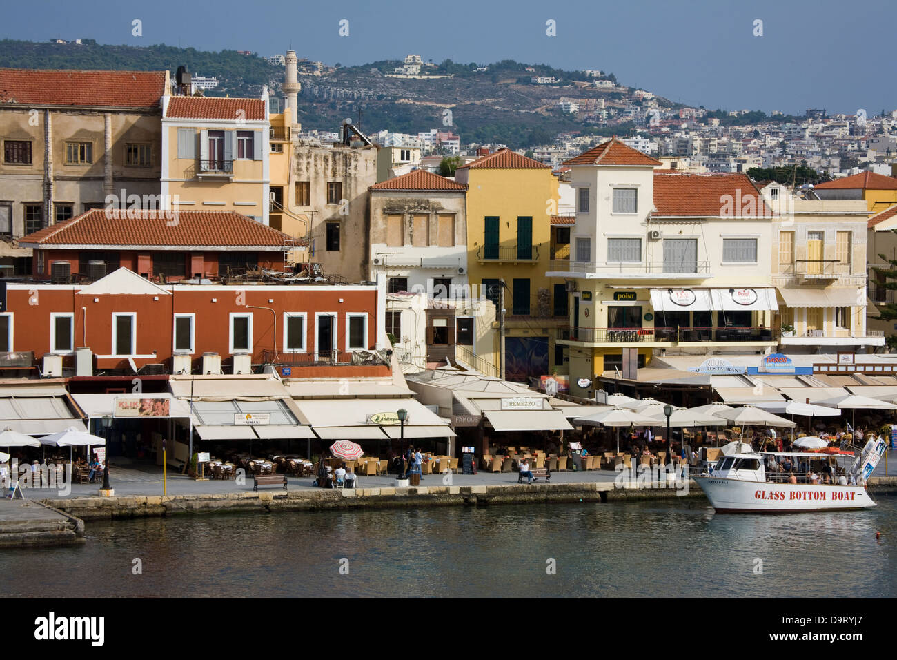 A broad promenade lined with tourist shops and cafes circles the lovely ...