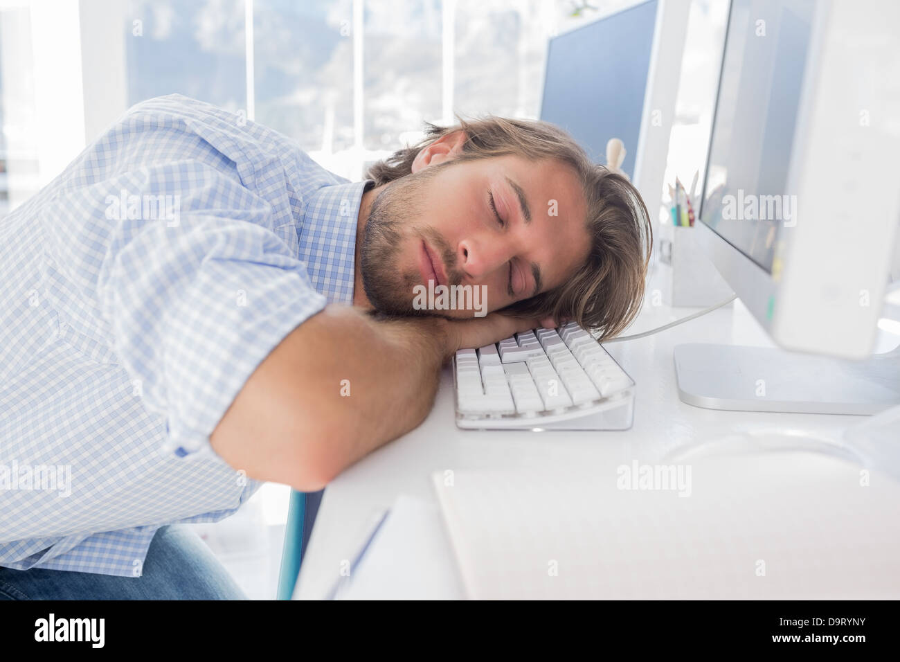 Man sleeping on his desk Stock Photo - Alamy