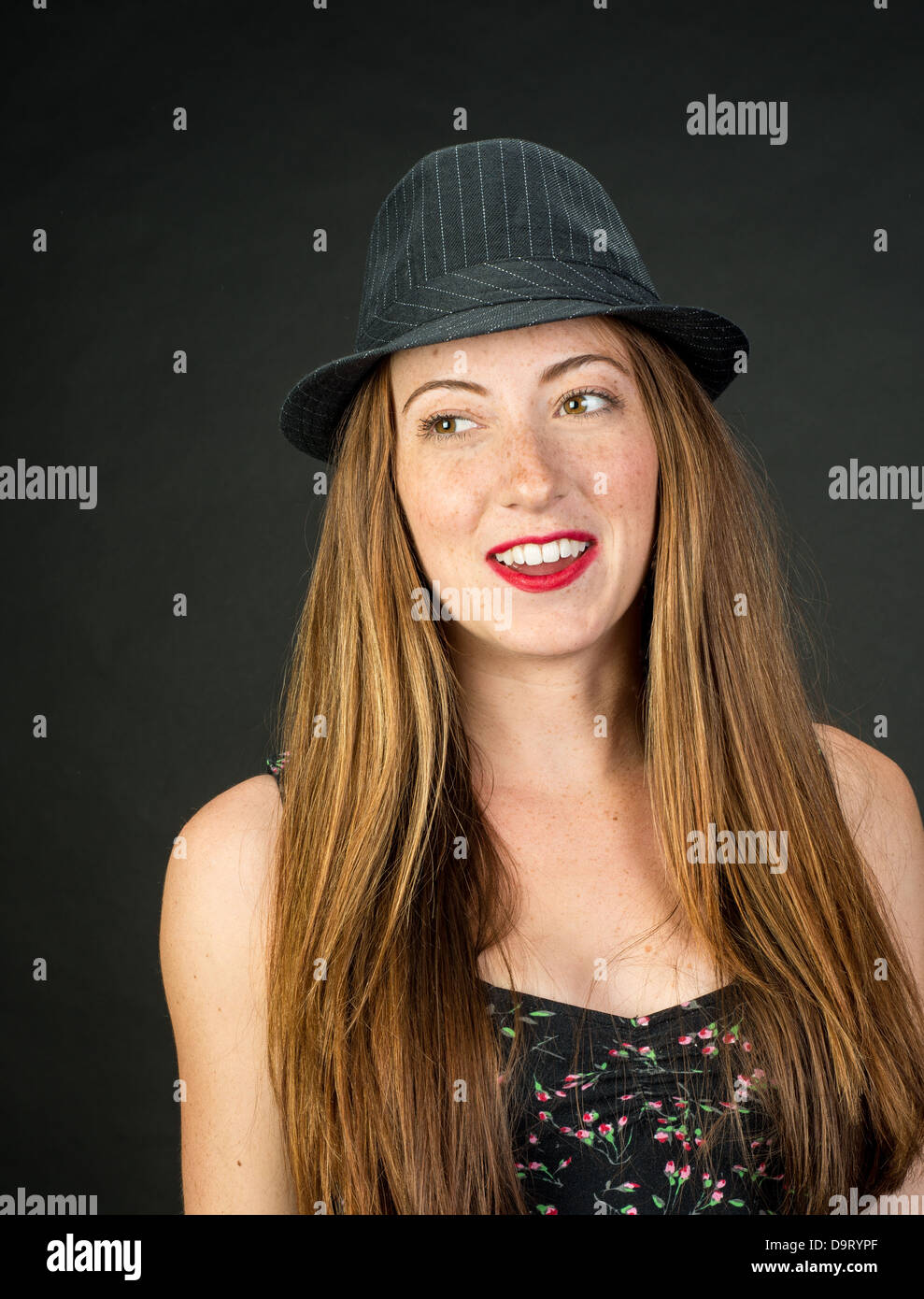 Very cute girl with red hair and freckles wearing a pinstriped fedora ...