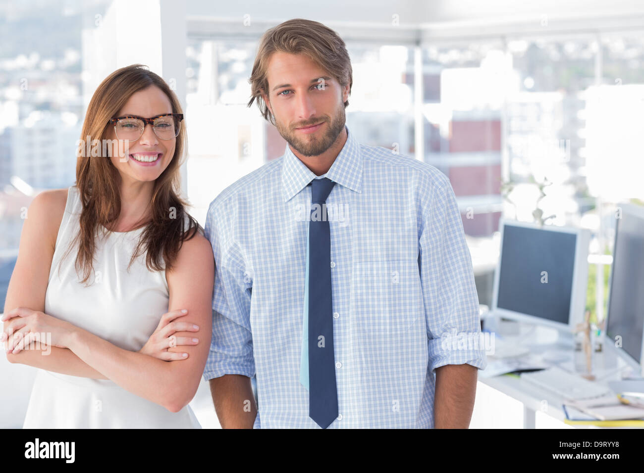 Design team standing in office Stock Photo - Alamy