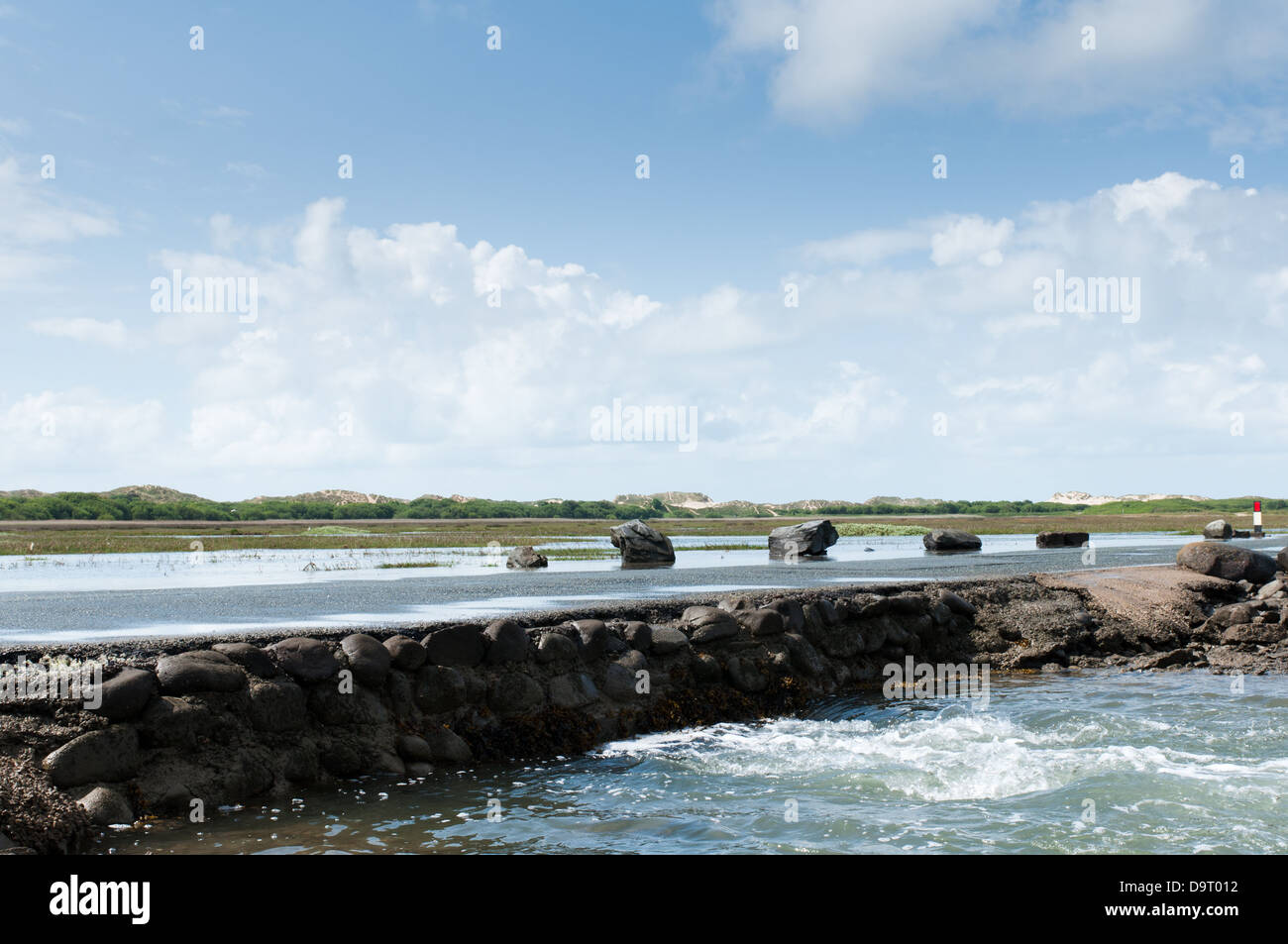 The causeway to Shell Island is covered by sea water at high tide. The ...