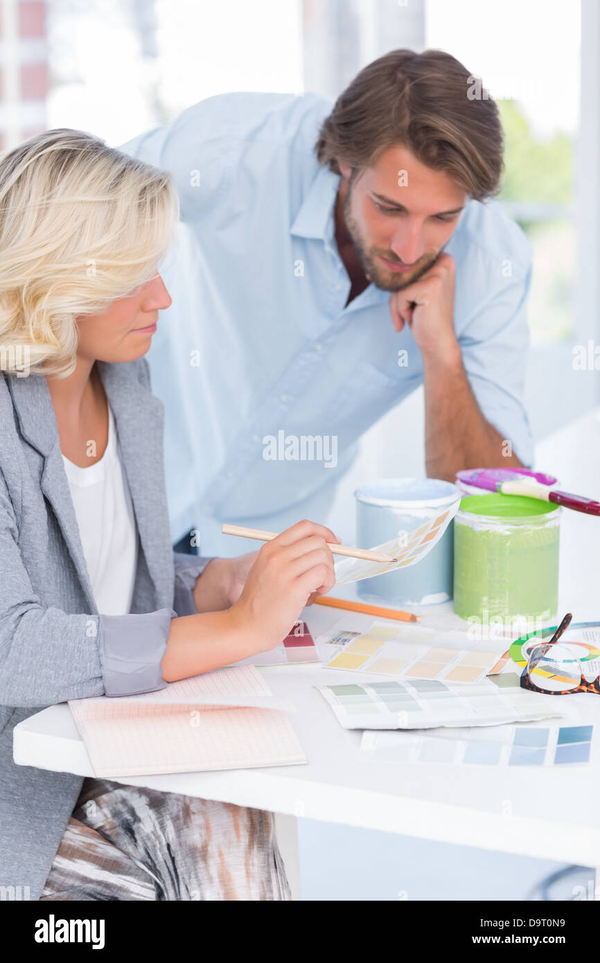 Colleagues of interior design working together on colour charts Stock ...