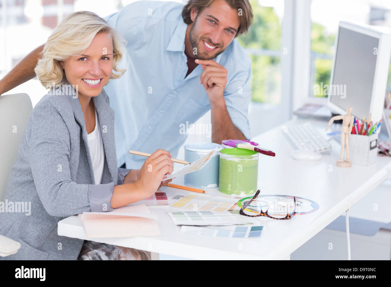 Smiling colleagues of interior design working together Stock Photo - Alamy