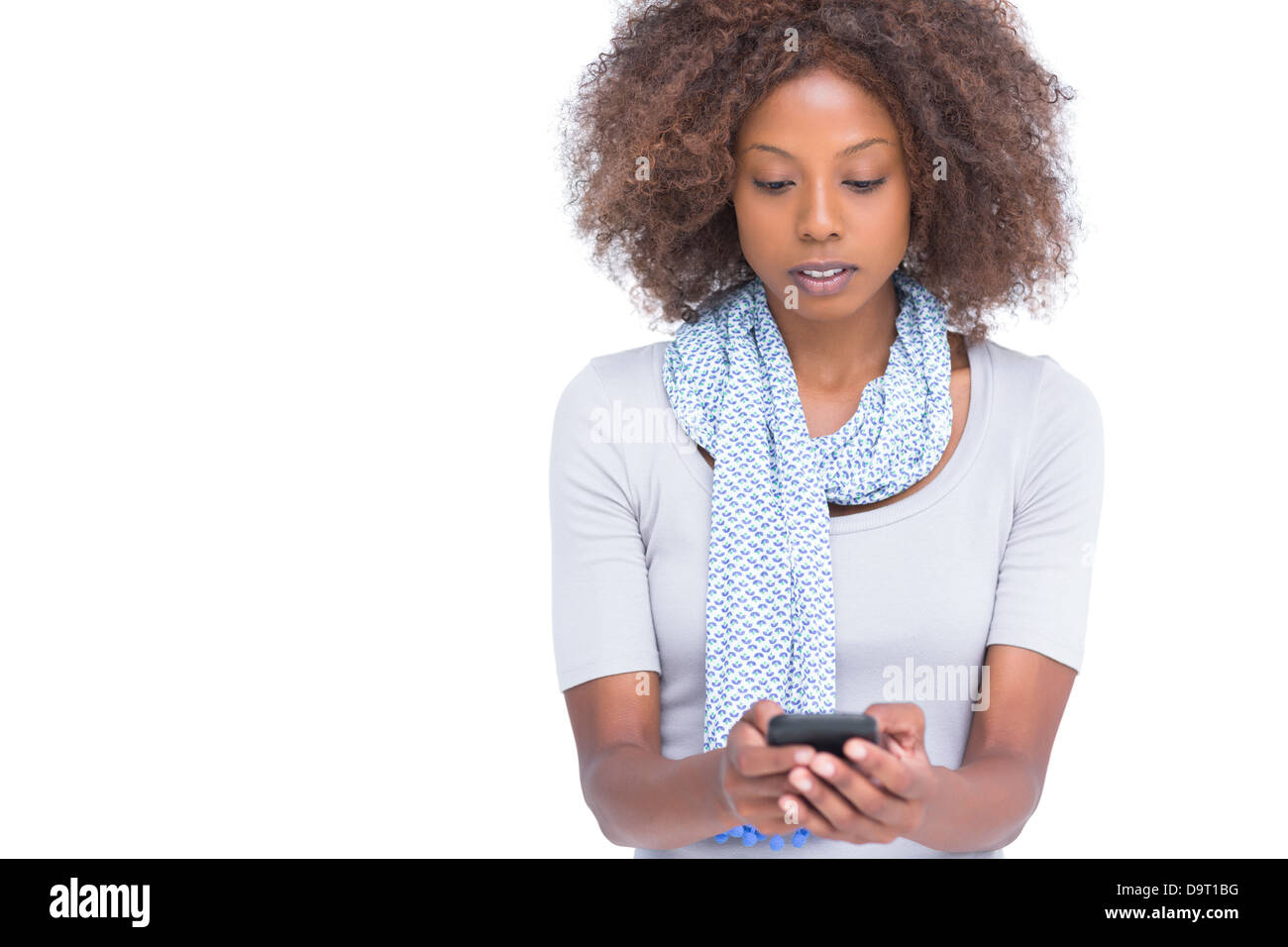 Concentrated woman typing a text message Stock Photo - Alamy