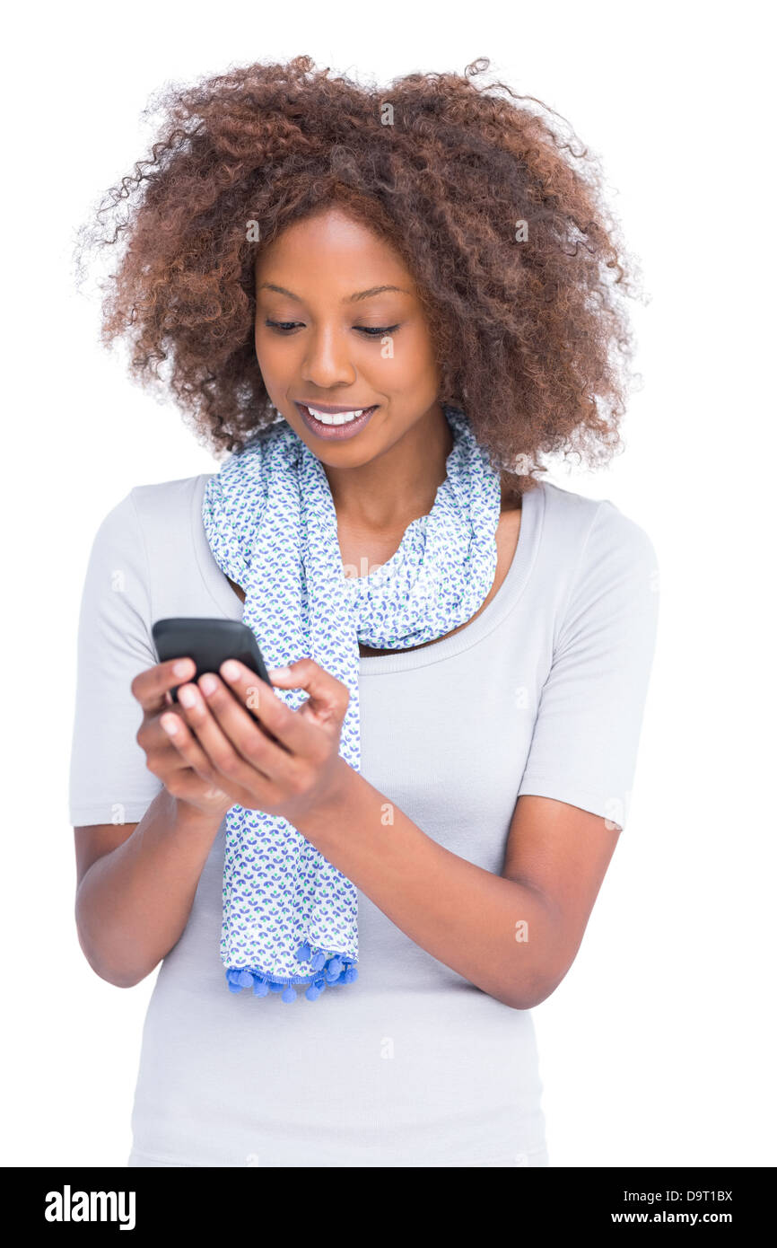 Smiling woman typing a text message on her smartphone Stock Photo - Alamy