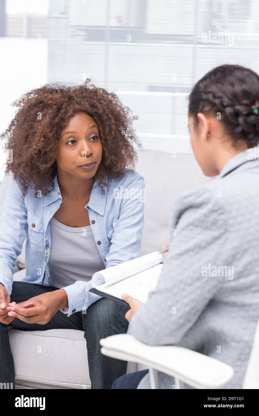 Therapist taking notes Stock Photo - Alamy