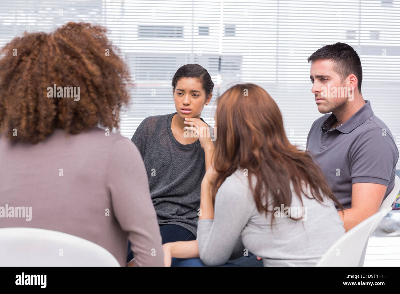Patients listening to another patient Stock Photo - Alamy