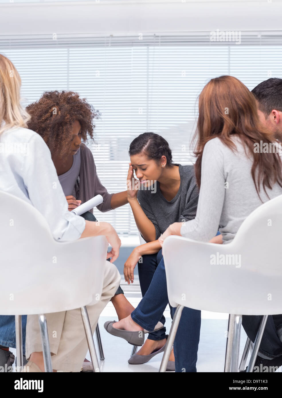 Therapist encouraging a patient Stock Photo - Alamy