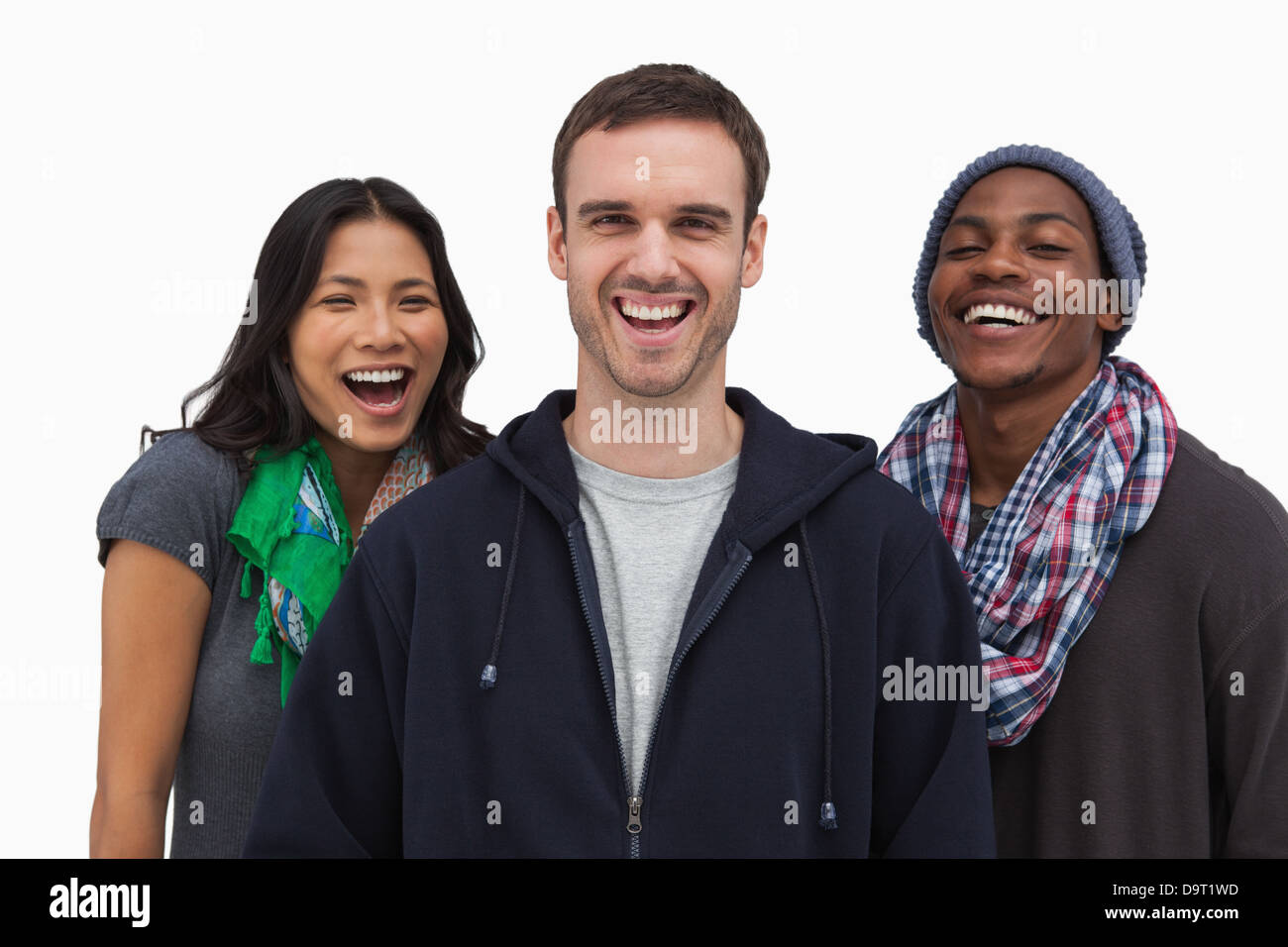 Stylish young friends laughing at camera Stock Photo - Alamy