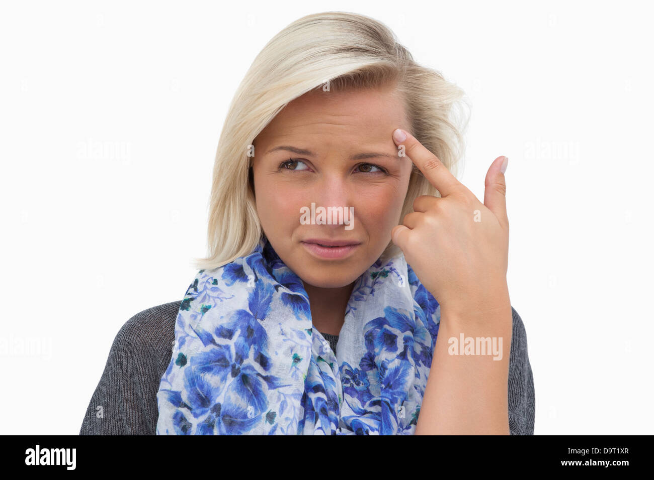 Woman pointing to forehead hi-res stock photography and images - Alamy