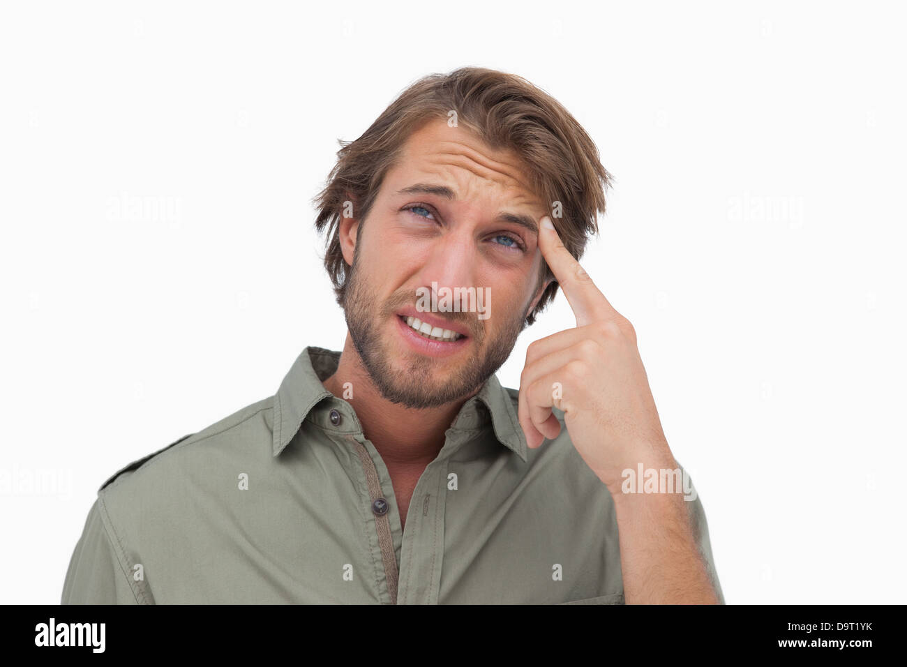 Man with headache looking up and touching his head Stock Photo - Alamy