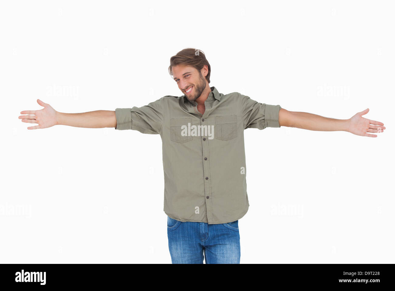 Man standing with arms outstretched Stock Photo - Alamy