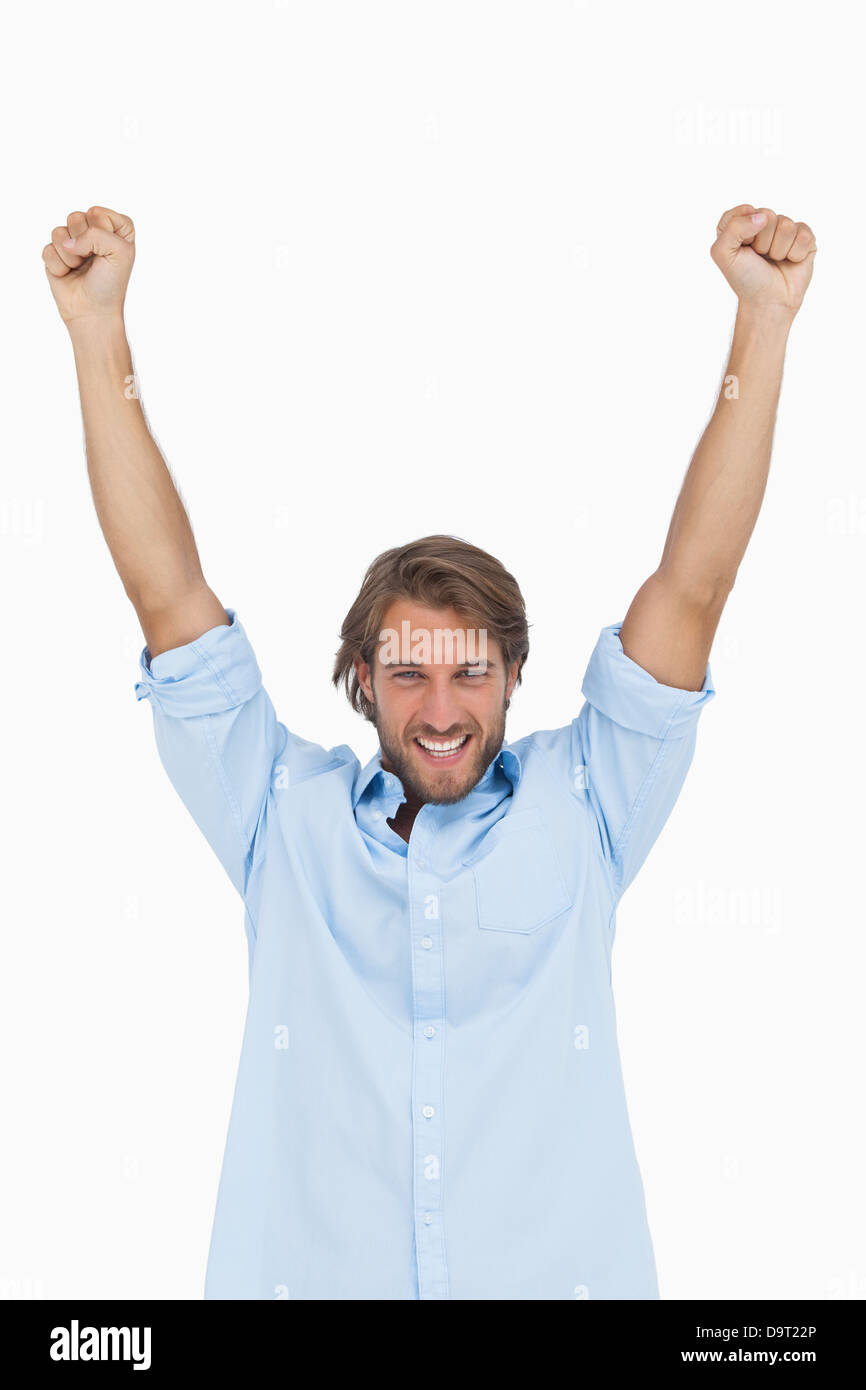 Happy man celebrating success with arms up Stock Photo - Alamy