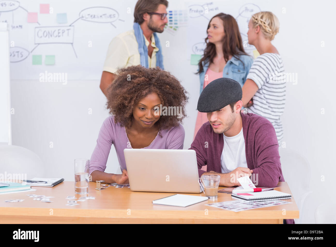 Team of editors and designers working and chatting Stock Photo - Alamy