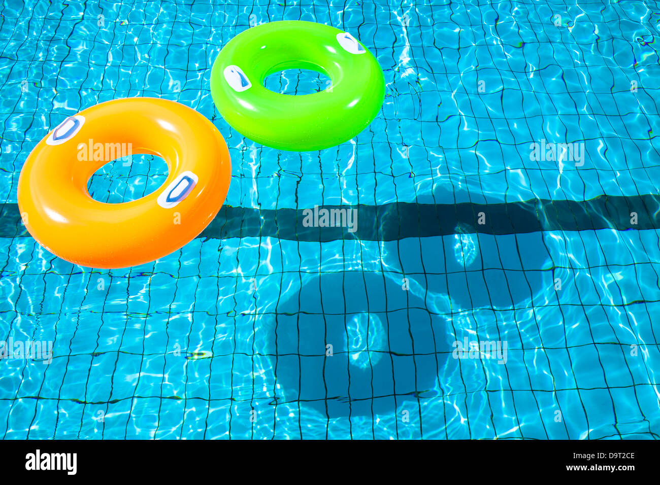 two swimming pool rings with shadow Stock Photo - Alamy