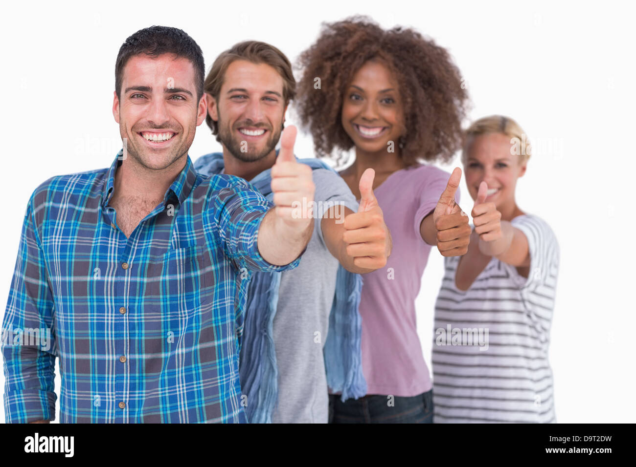 Happy stylish group giving thumbs up Stock Photo - Alamy