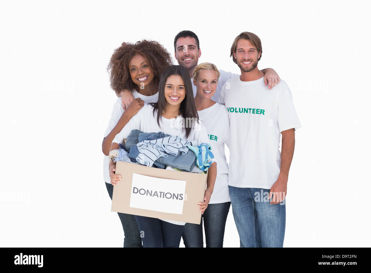 Smiling group of volunteers holding donation box Stock Photo - Alamy