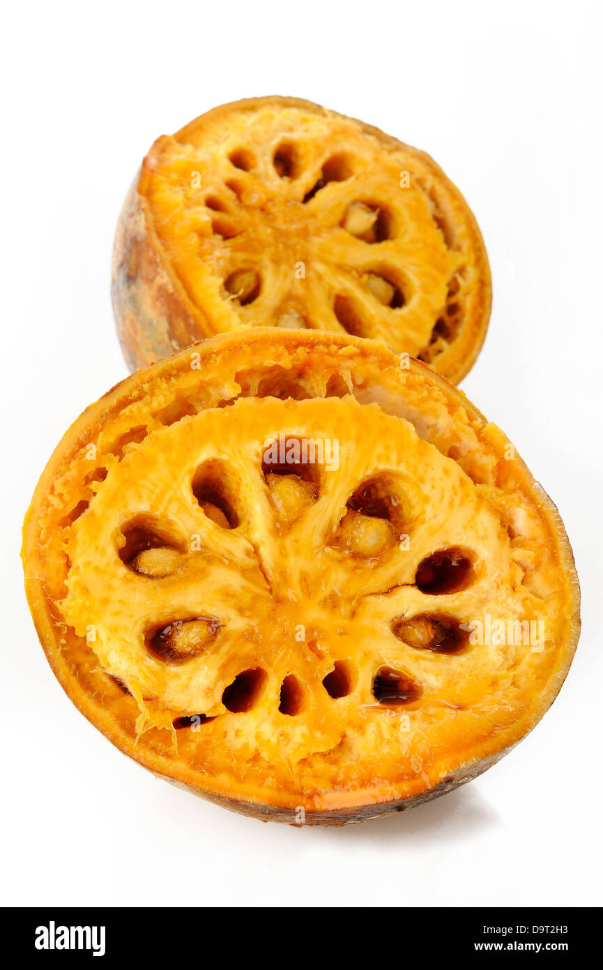 ripe bael fruit on white background Stock Photo - Alamy