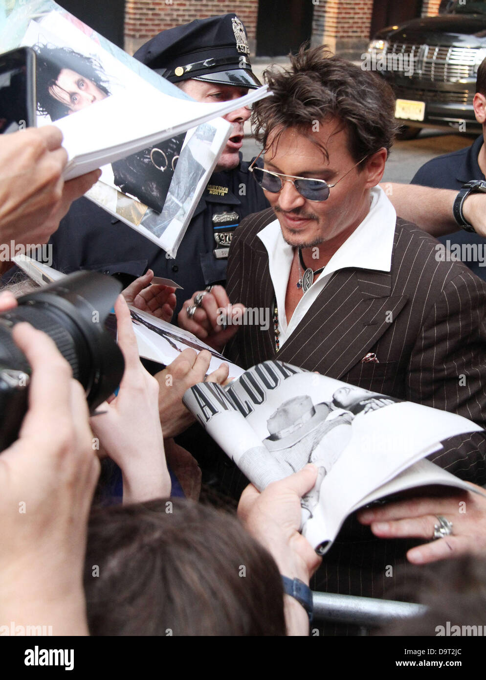 New York, U.S. June 25, 2013. Actor JOHNNY DEPP signs autographs for ...