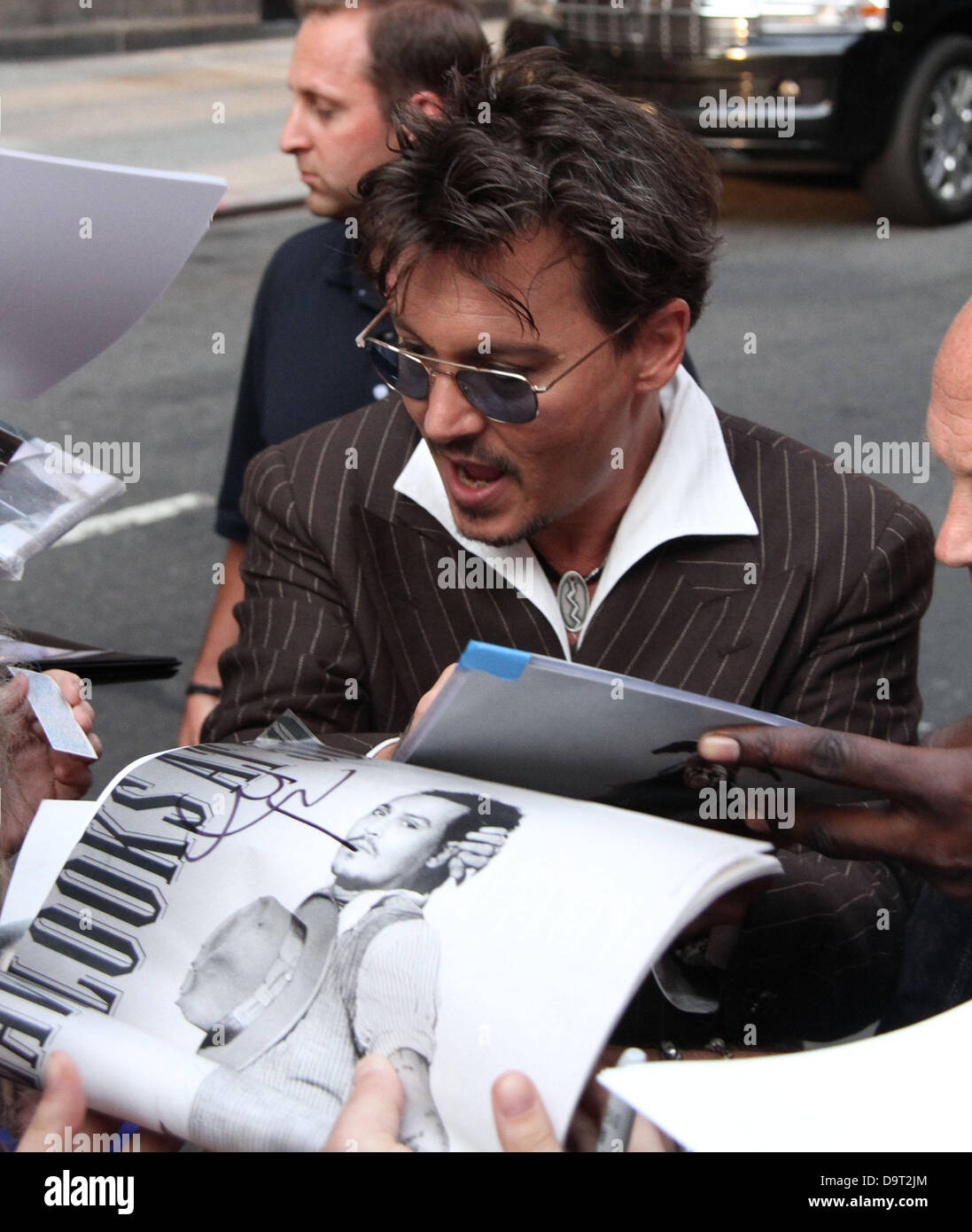 New York, U.S. June 25, 2013. Actor JOHNNY DEPP signs autographs for ...
