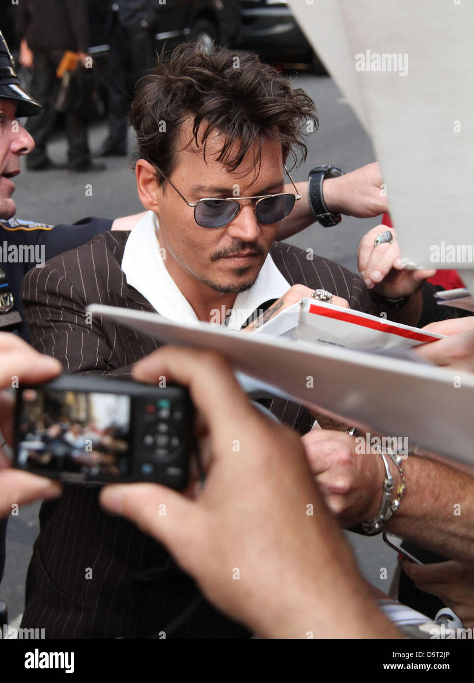 New York, U.S. June 25, 2013. Actor JOHNNY DEPP signs autographs for ...