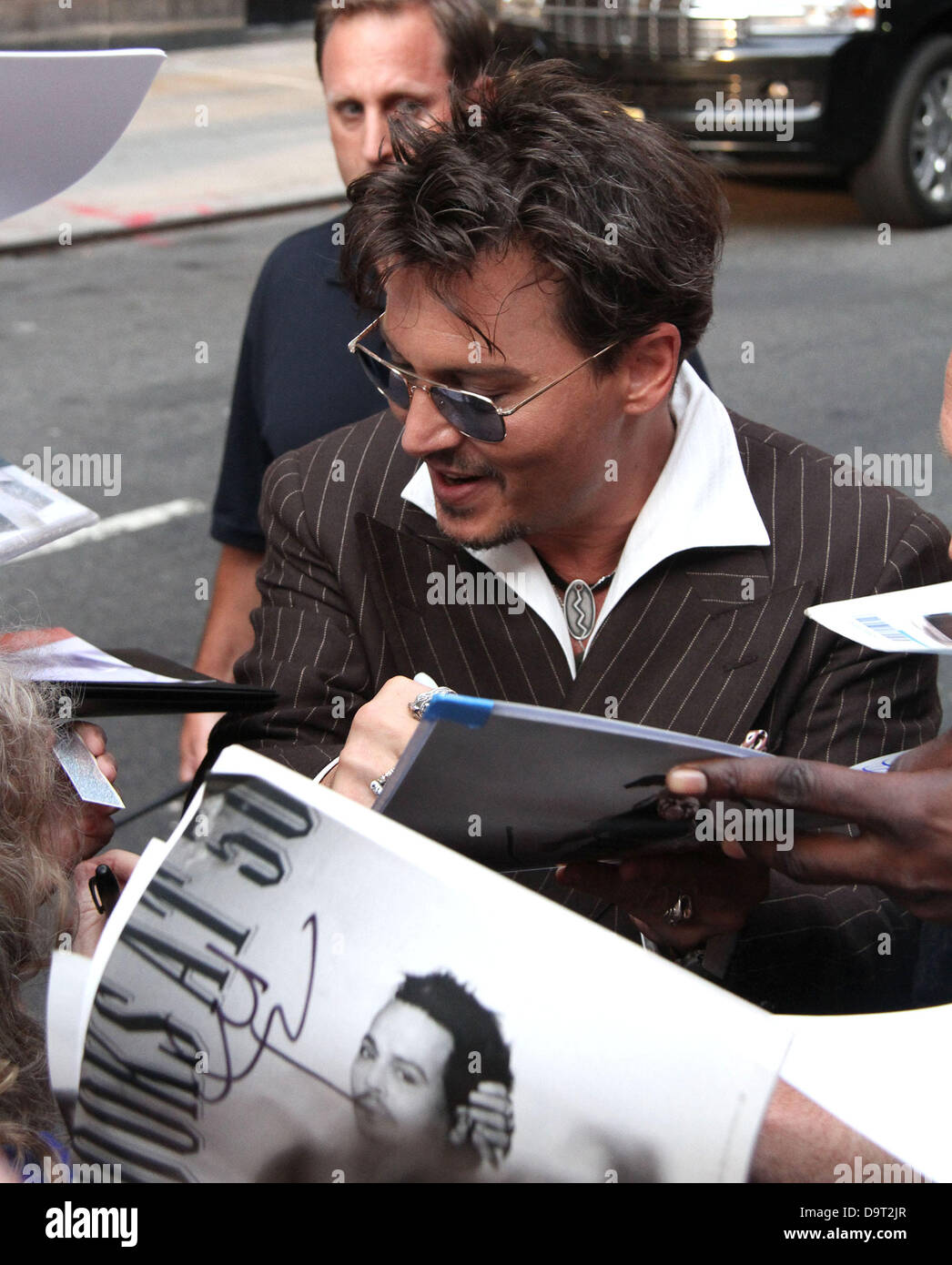 New York, U.S. June 25, 2013. Actor JOHNNY DEPP signs autographs for ...