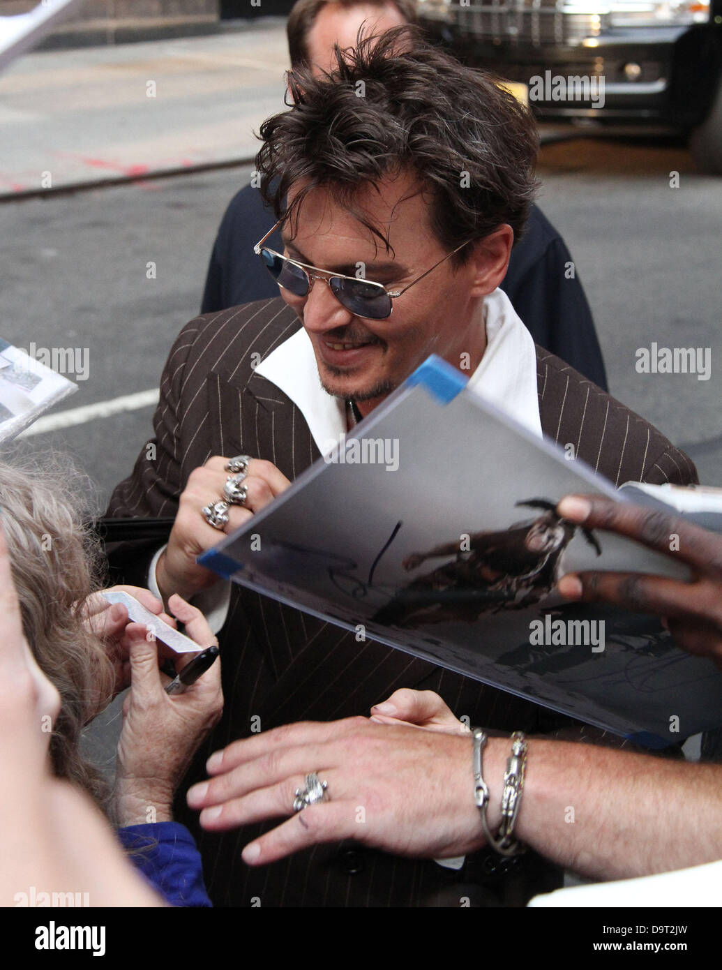 New York, U.S. June 25, 2013. Actor JOHNNY DEPP signs autographs for ...