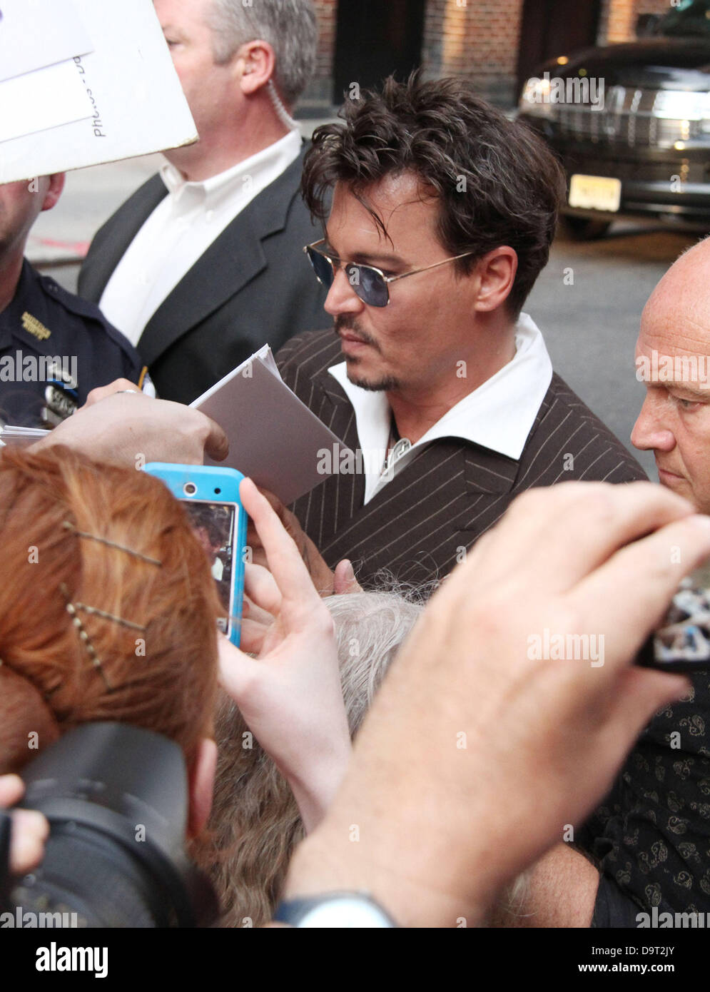 New York, U.S. June 25, 2013. Actor JOHNNY DEPP signs autographs for ...