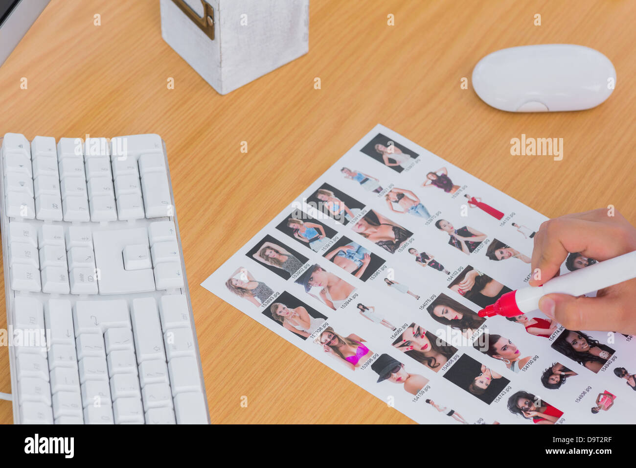 Close up of hand marking contact sheet Stock Photo - Alamy